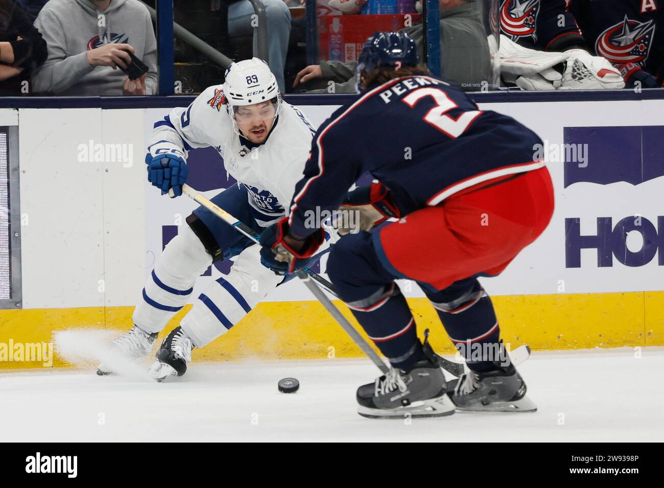 Toronto Maple Leafs' Nicholas Robertson, left, tries to skate past ...