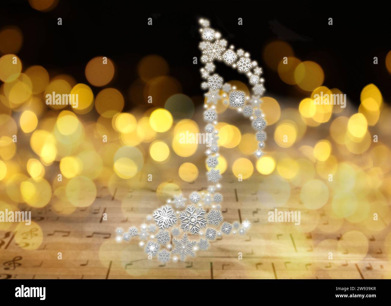 Music note made of snowflakes over sheet with musical symbols. Bokeh ...