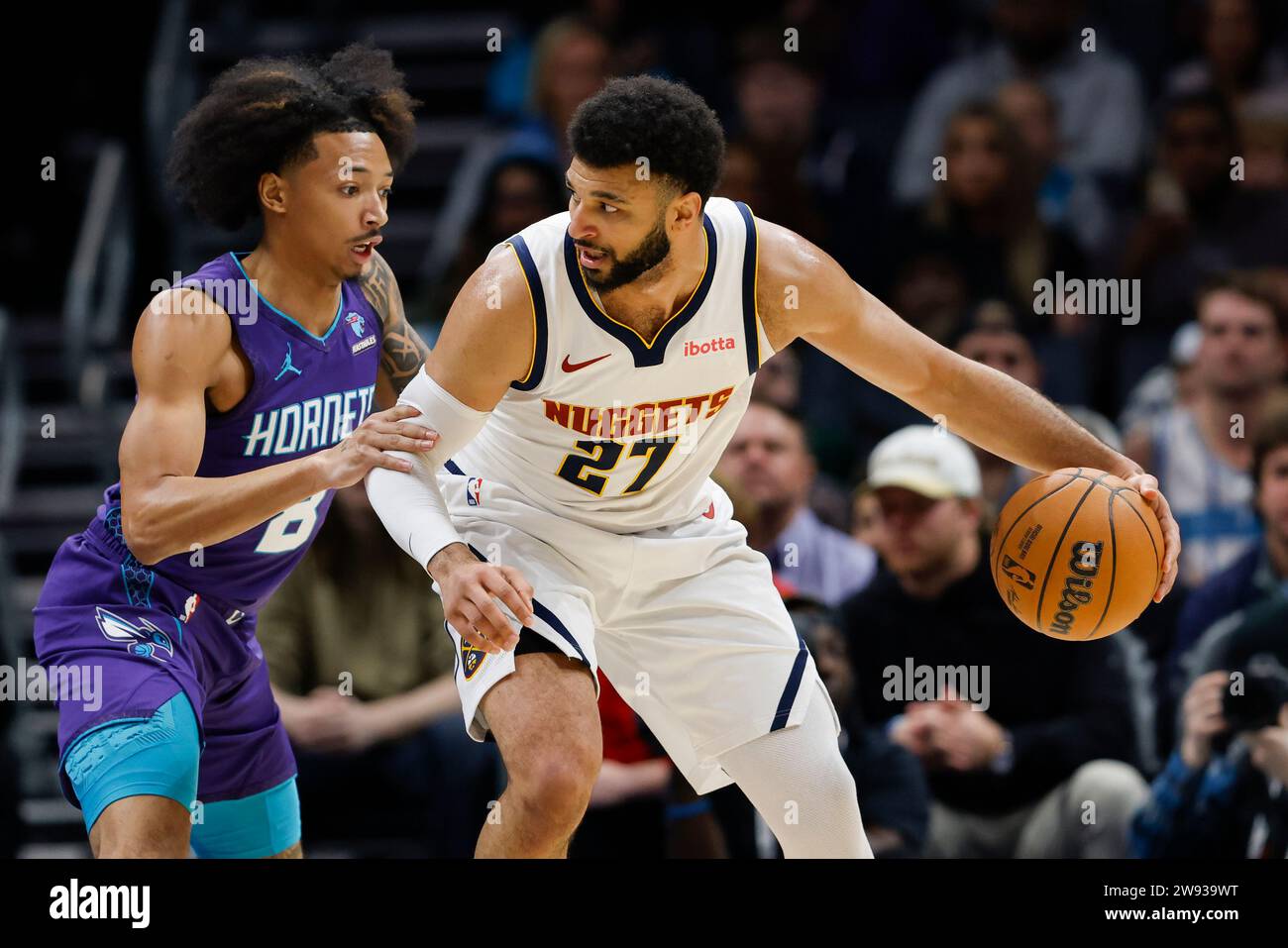 Denver Nuggets guard Jamal Murray (27) is defended by Charlotte Hornets ...