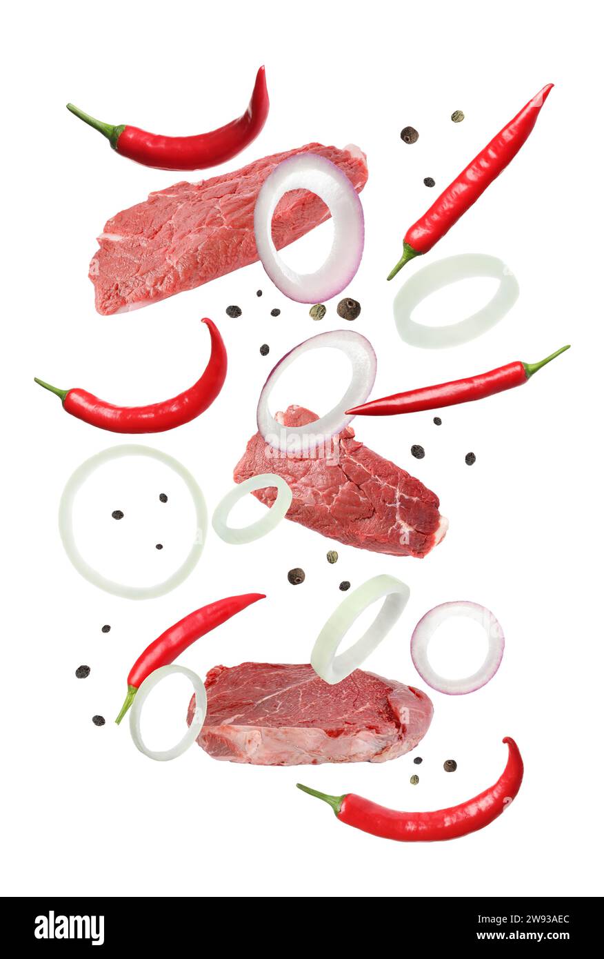 Beef meat and different spices falling on white background Stock Photo ...