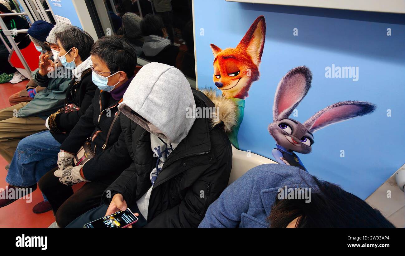 People ride a subway train decorated in the Zootopia theme on the ...