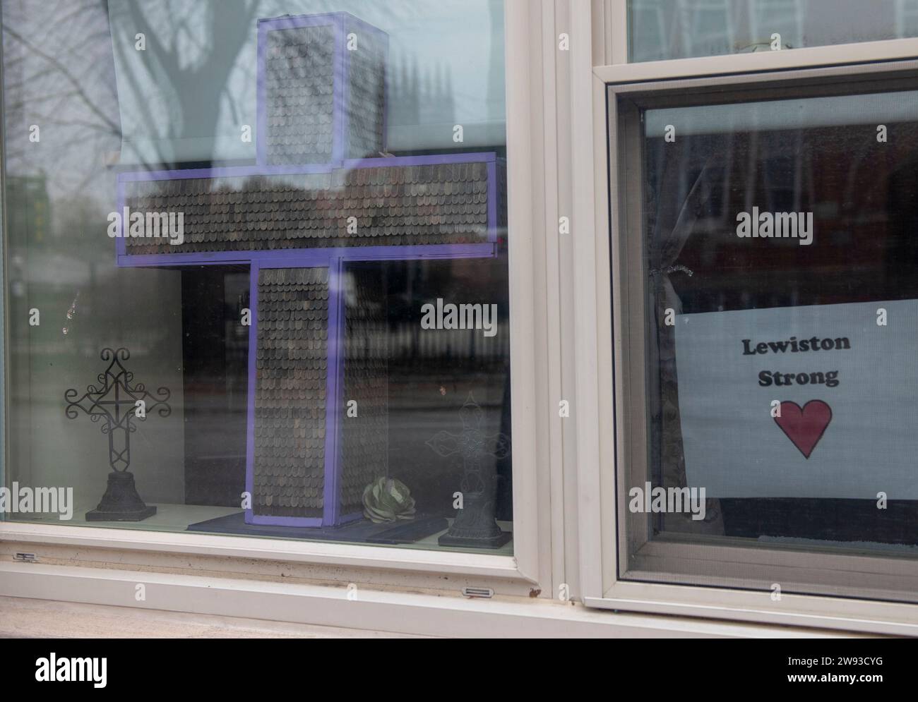 USA. 23rd Dec, 2023. A Lewiston strong sign and cross are seen in a ...