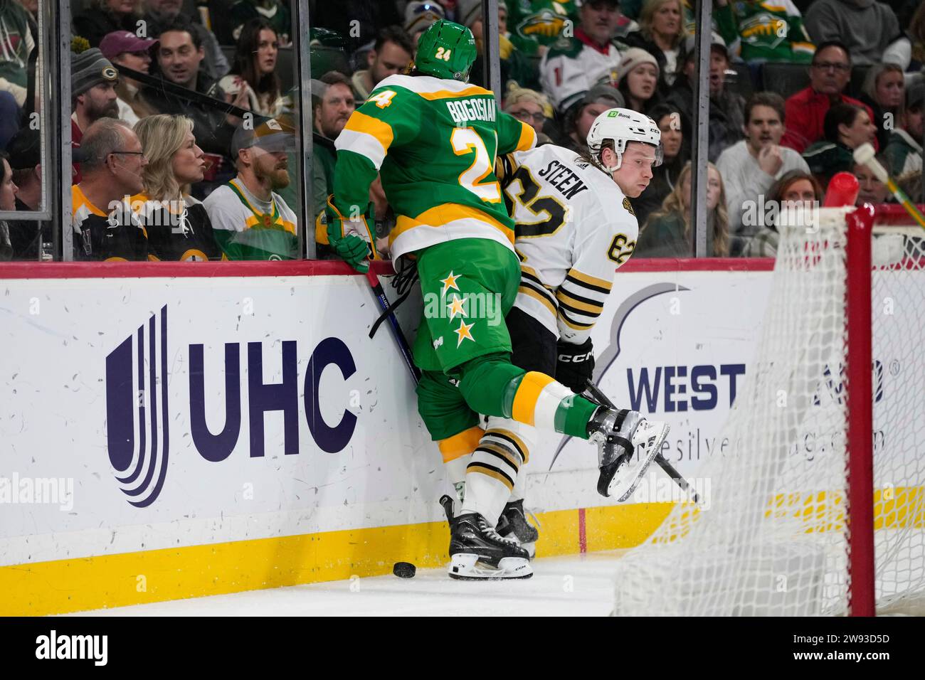 Minnesota Wild defenseman Zach Bogosian (24) and Boston Bruins center ...