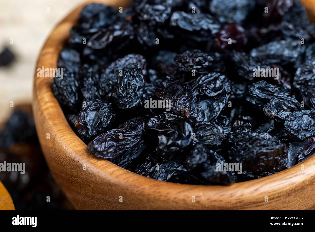 dried black raisins on the table, blue dry raisins for cooking desserts ...
