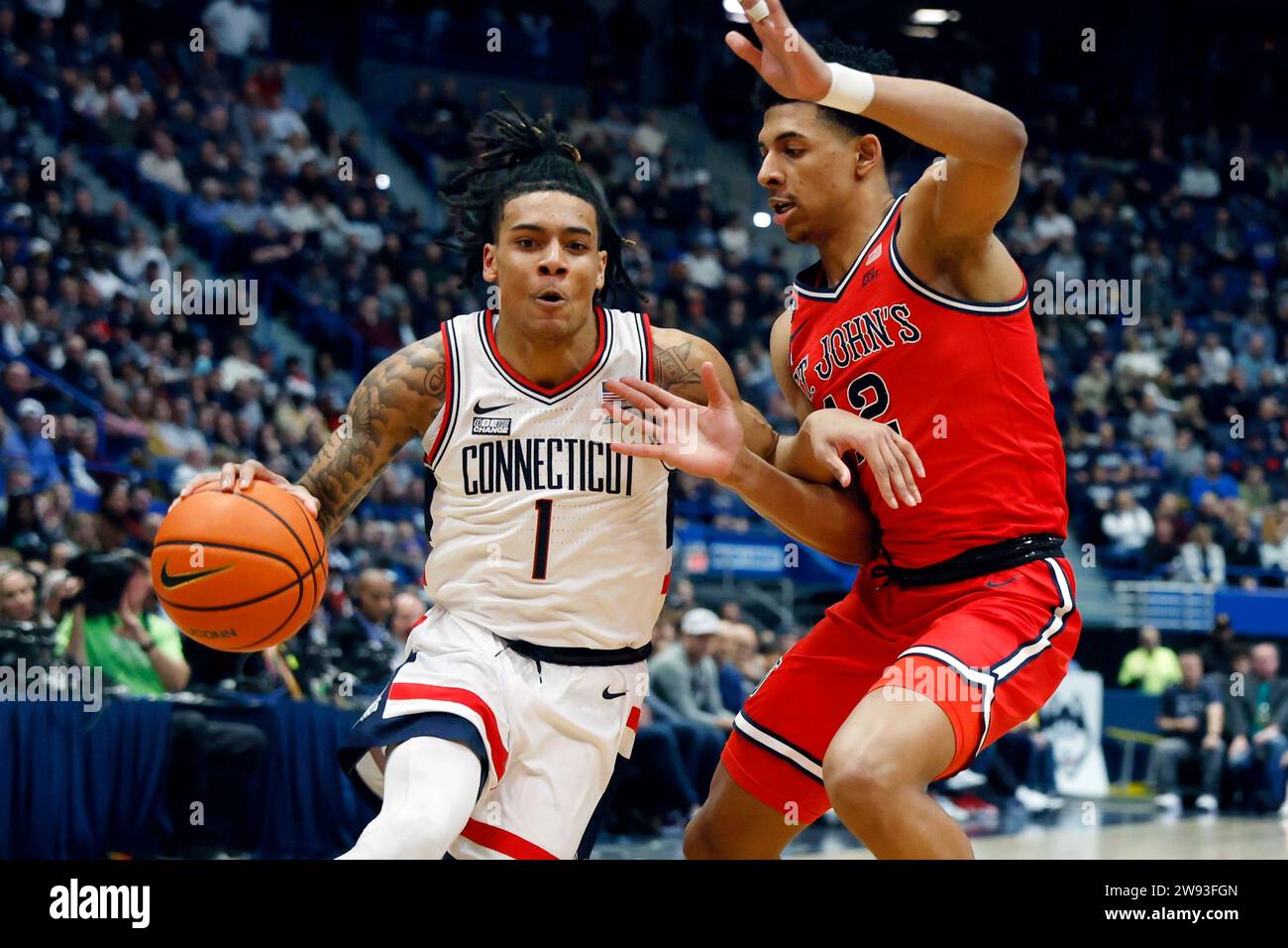 UConn's Solomon Ball (1) drives past St. John's RJ Luis Jr. (12) during ...