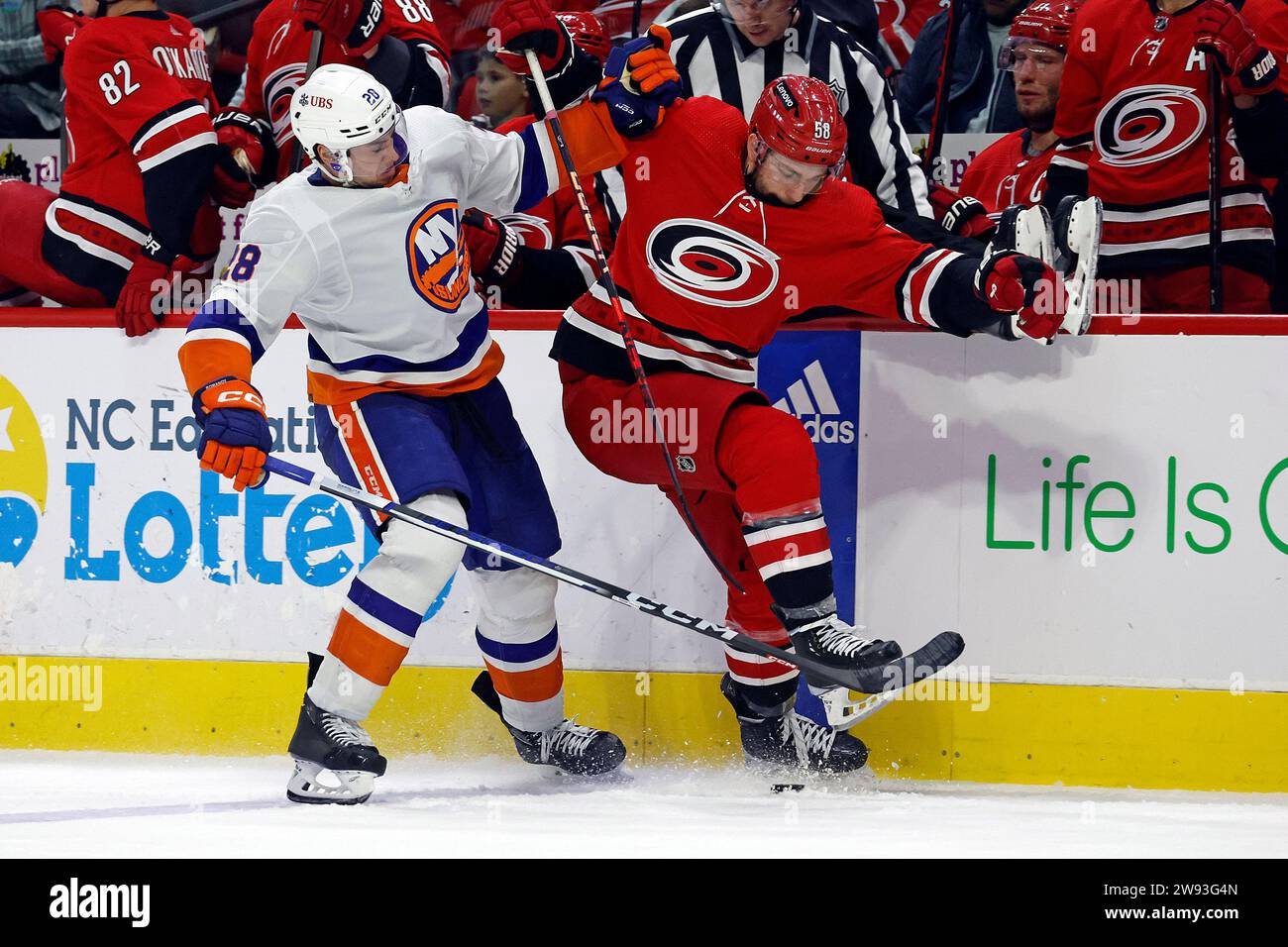 Carolina Hurricanes' Michael Bunting (58) battles for the puck with New ...
