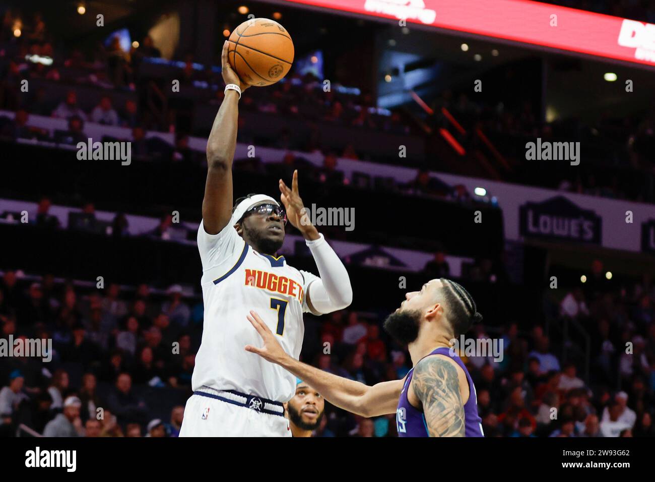 Denver Nuggets guard Reggie Jackson (7) shoots over Charlotte Hornets ...