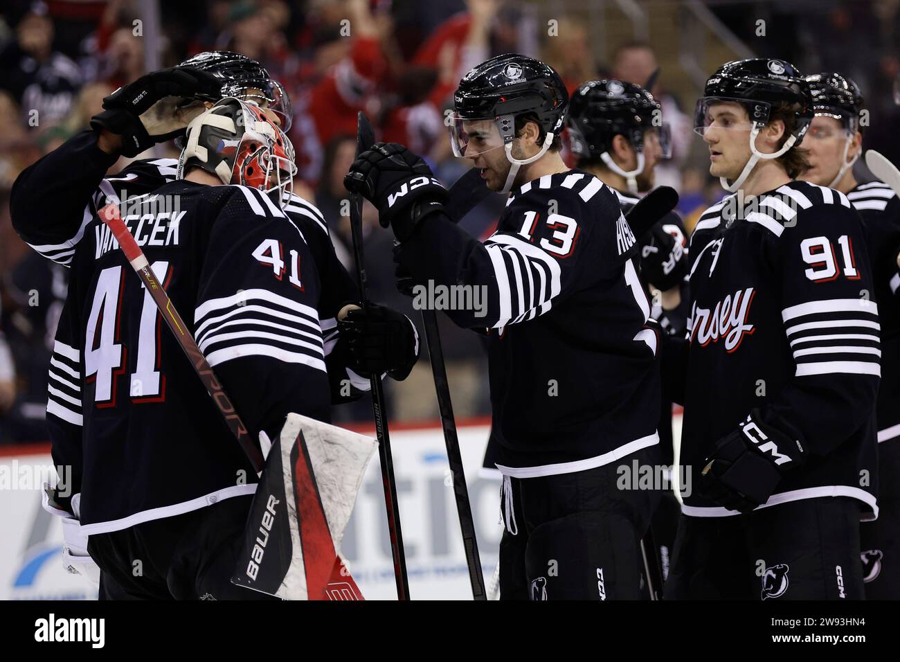 New Jersey Devils center Nico Hischier (13) congratulates goaltender ...