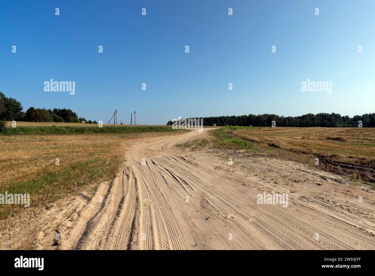 Rural road for cars and transport, ruts and traces of cars on a sandy ...