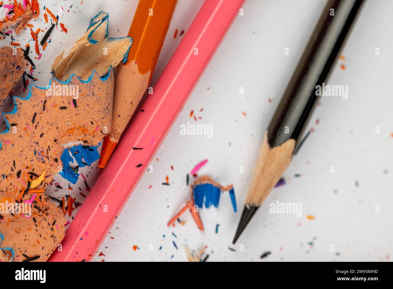sharp pencil of different colors on paper close-up , school supplies ...
