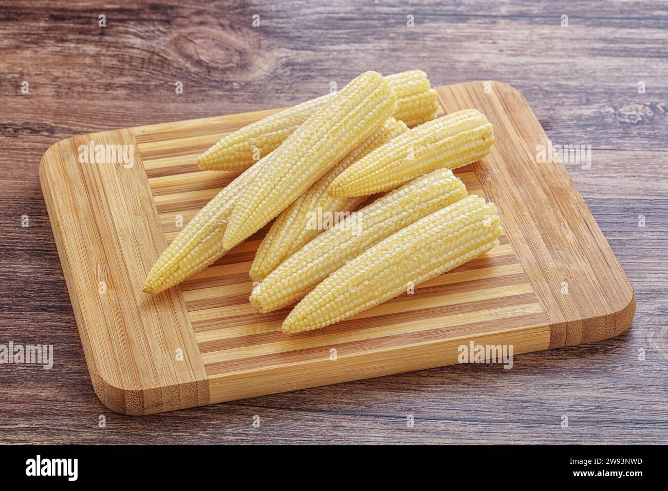 Raw natural organic baby corn heap Stock Photo - Alamy