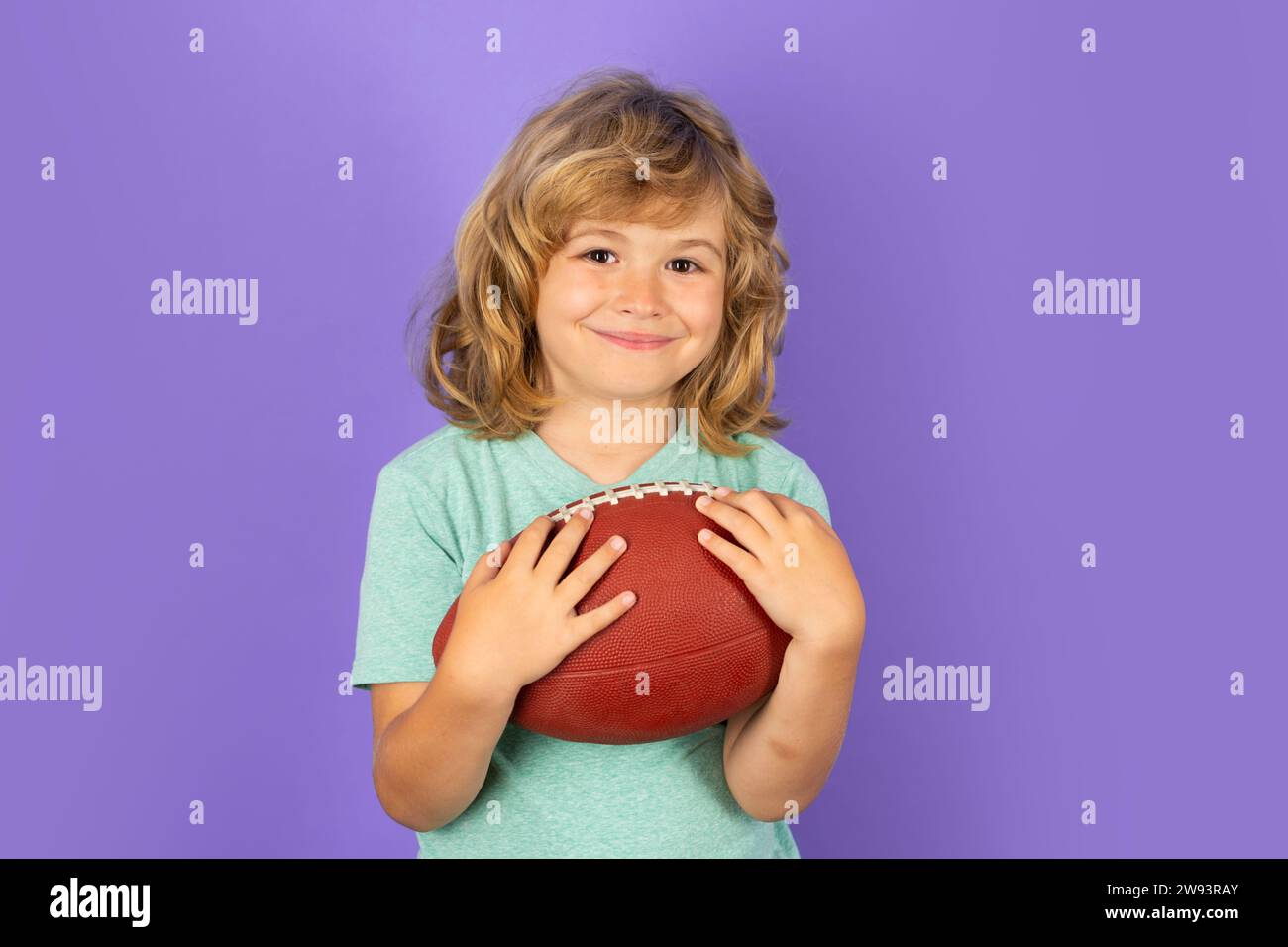American football. Boy with rugby ball. Child ready to throw a football ...