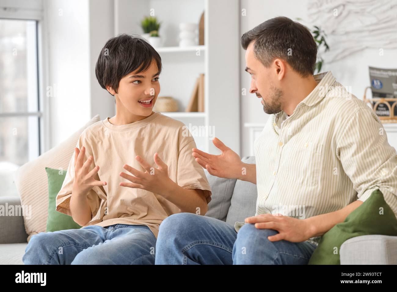 Teen father son talking sofa hi-res stock photography and images - Alamy