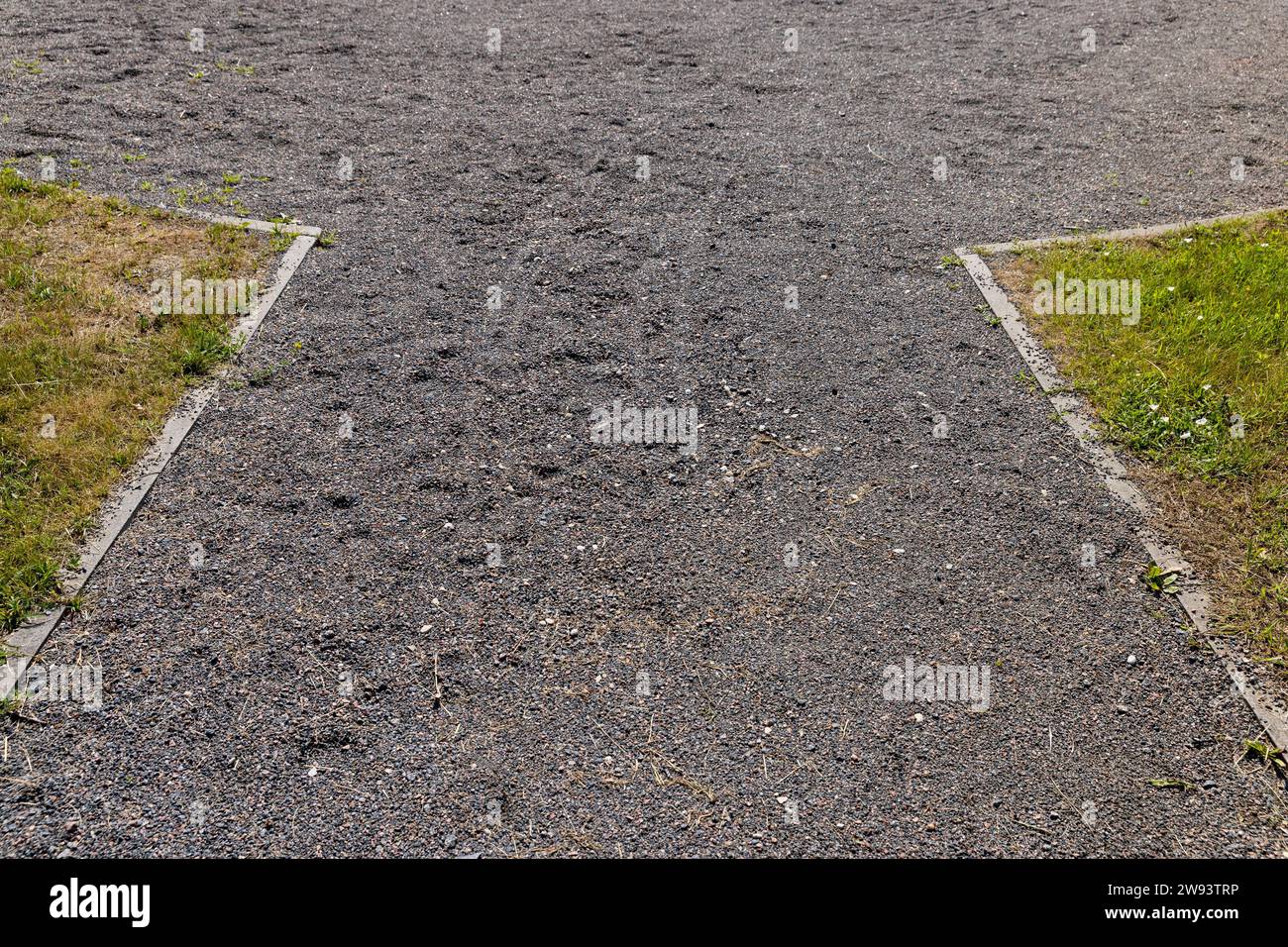 part of a walkway sprinkled with small rubble and stones, an ecological ...