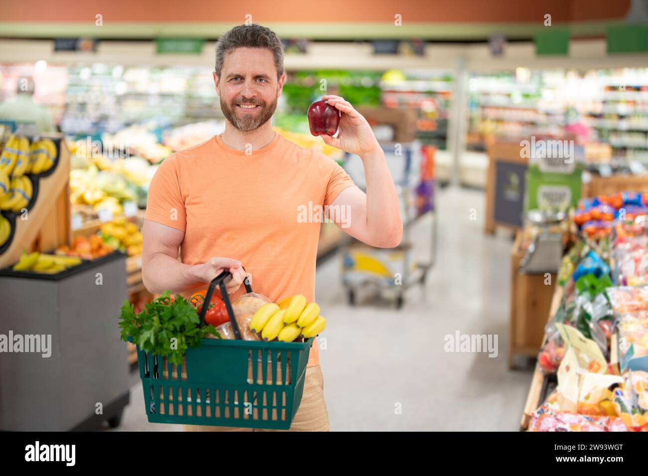 Man with fruits and vegetables at grocery store. Healthy food for mens ...