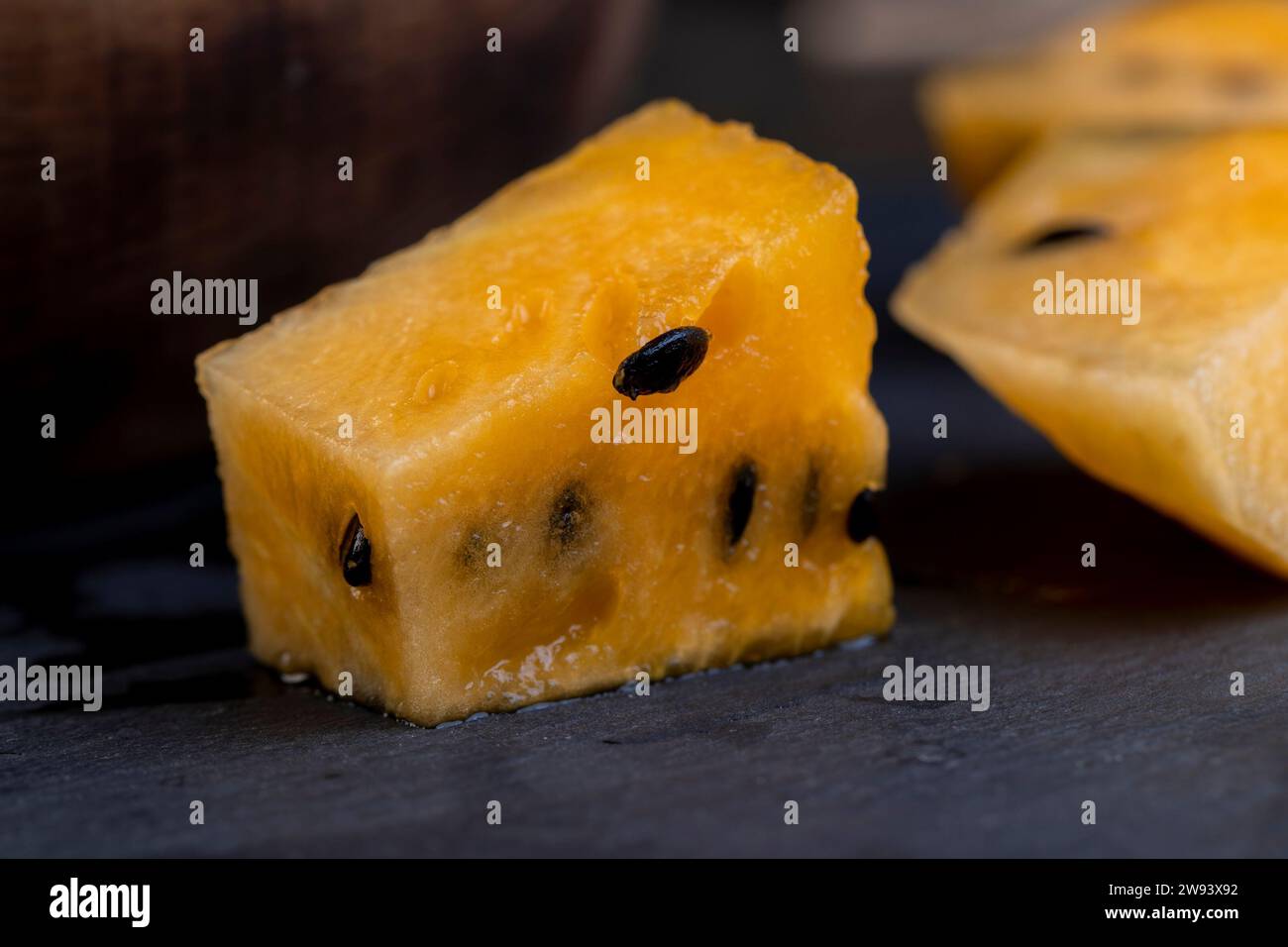 ripe orange watermelon with black pits , sweet and juicy orange ...