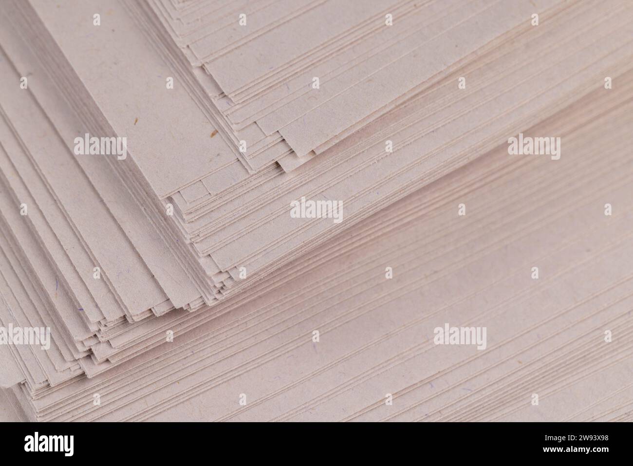 grey low-quality thin paper from recycled waste, paper used for writing ...