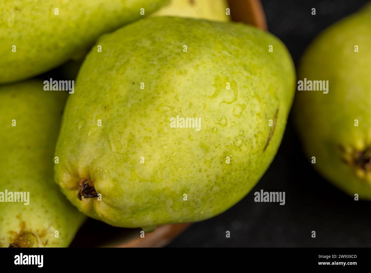 whole ripe and juicy green pears, delicious pears washed and ready for ...