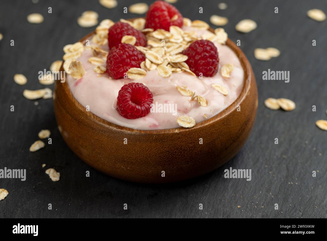 fresh yogurt with raspberry flavor and oat flakes , milk yogurt with ...