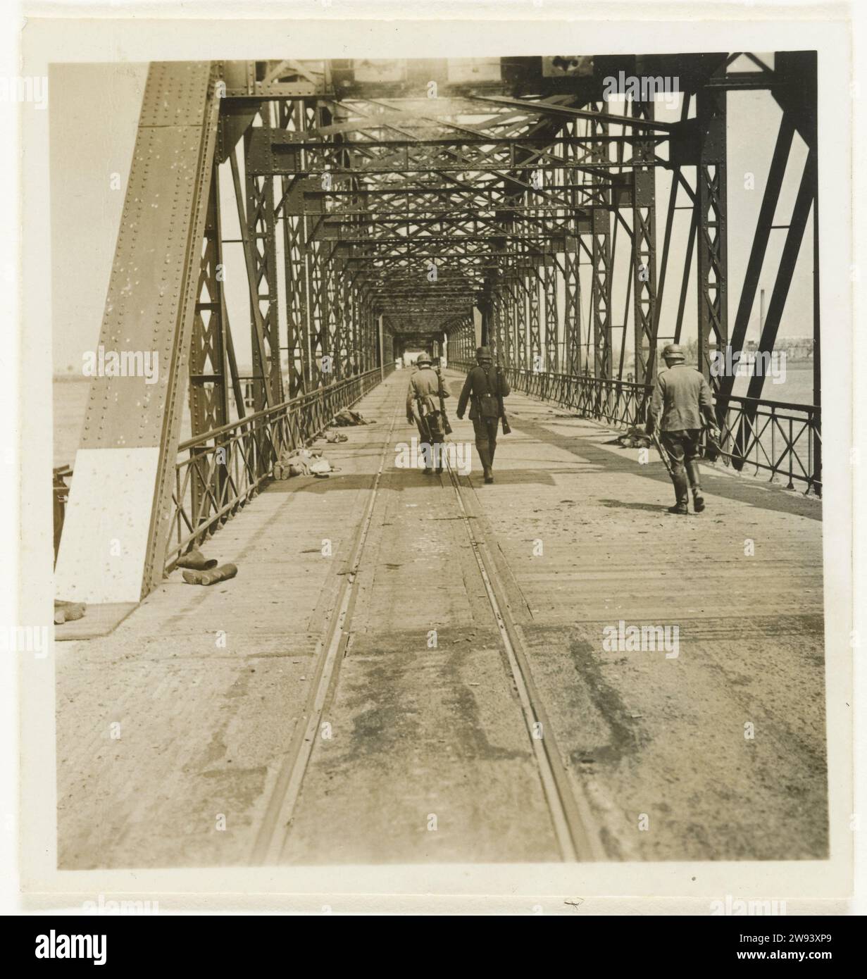 German soldiers on a conquered bridge, 1940 photograph Three German ...