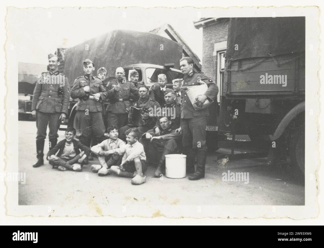 Wehrmacht soldiers with Dutch boys, 1941 - 1942 photograph A group of ...