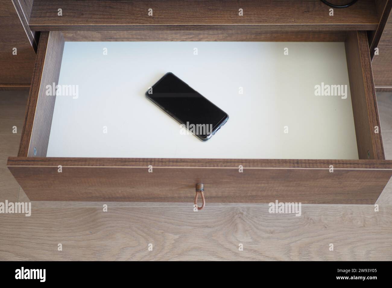 mobile phone in open drawer Stock Photo - Alamy