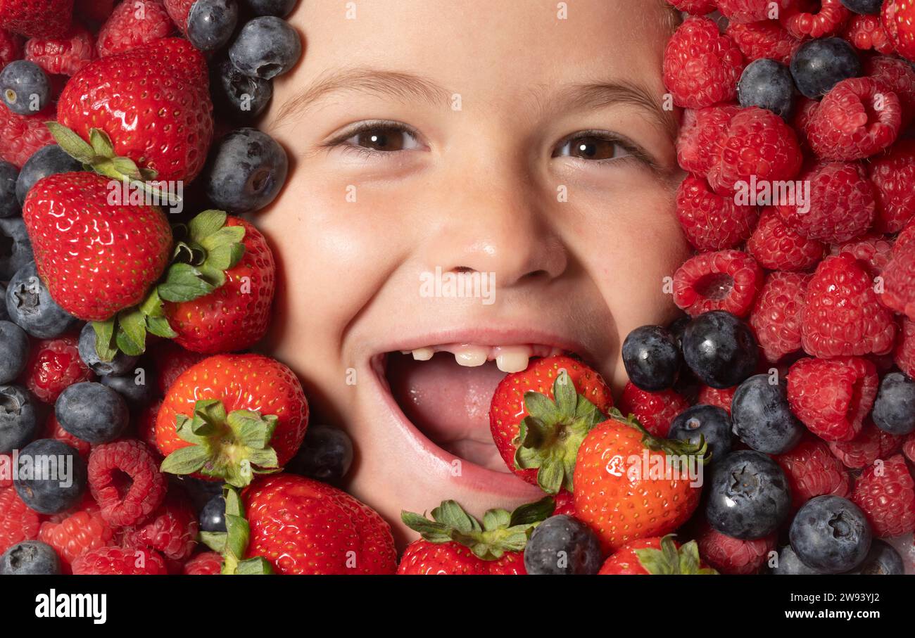 Healthy vitamins fruits. The kids face with fruit and berries. Summer ...