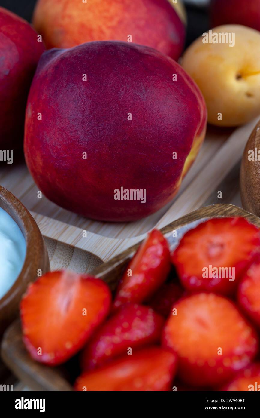 ripe delicious peaches on the table, making desserts with fruit peaches ...