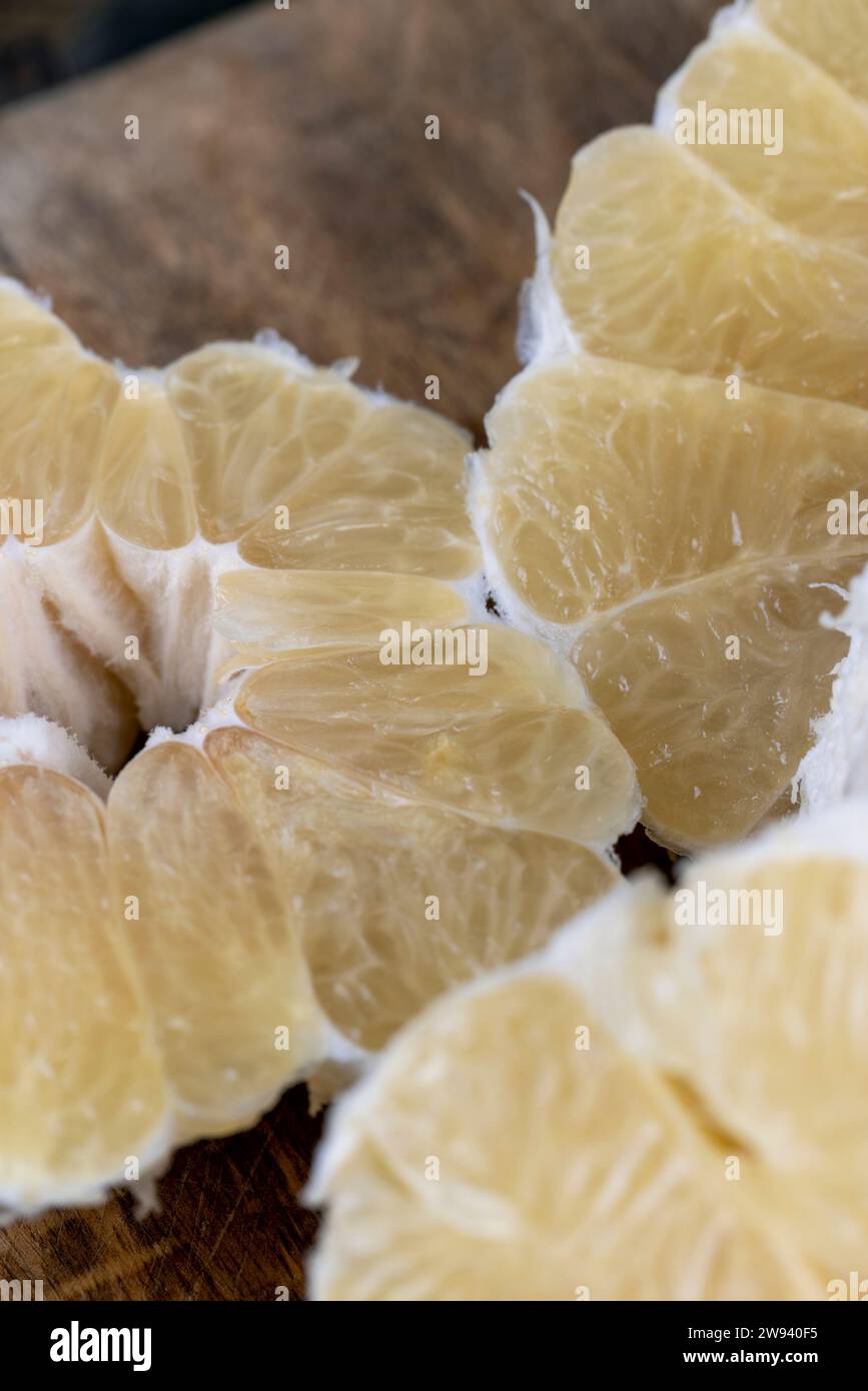 peeled pomelo on the table, cooking with ripe yellow pomelo Stock Photo ...