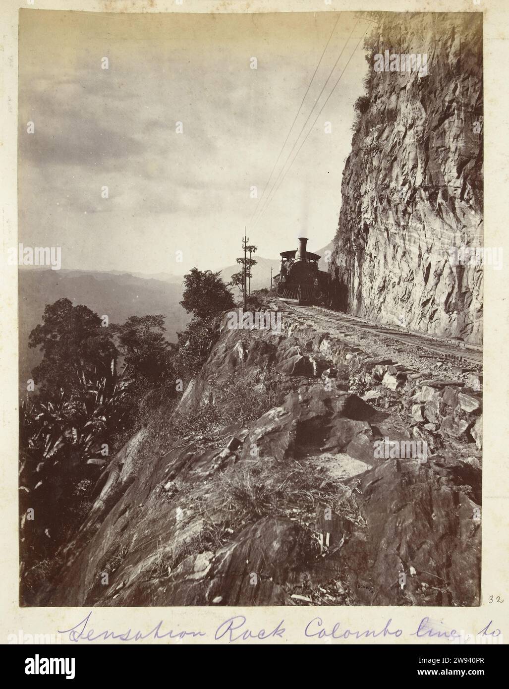 Steam train on a railway line through the mountain landscape of Sri ...