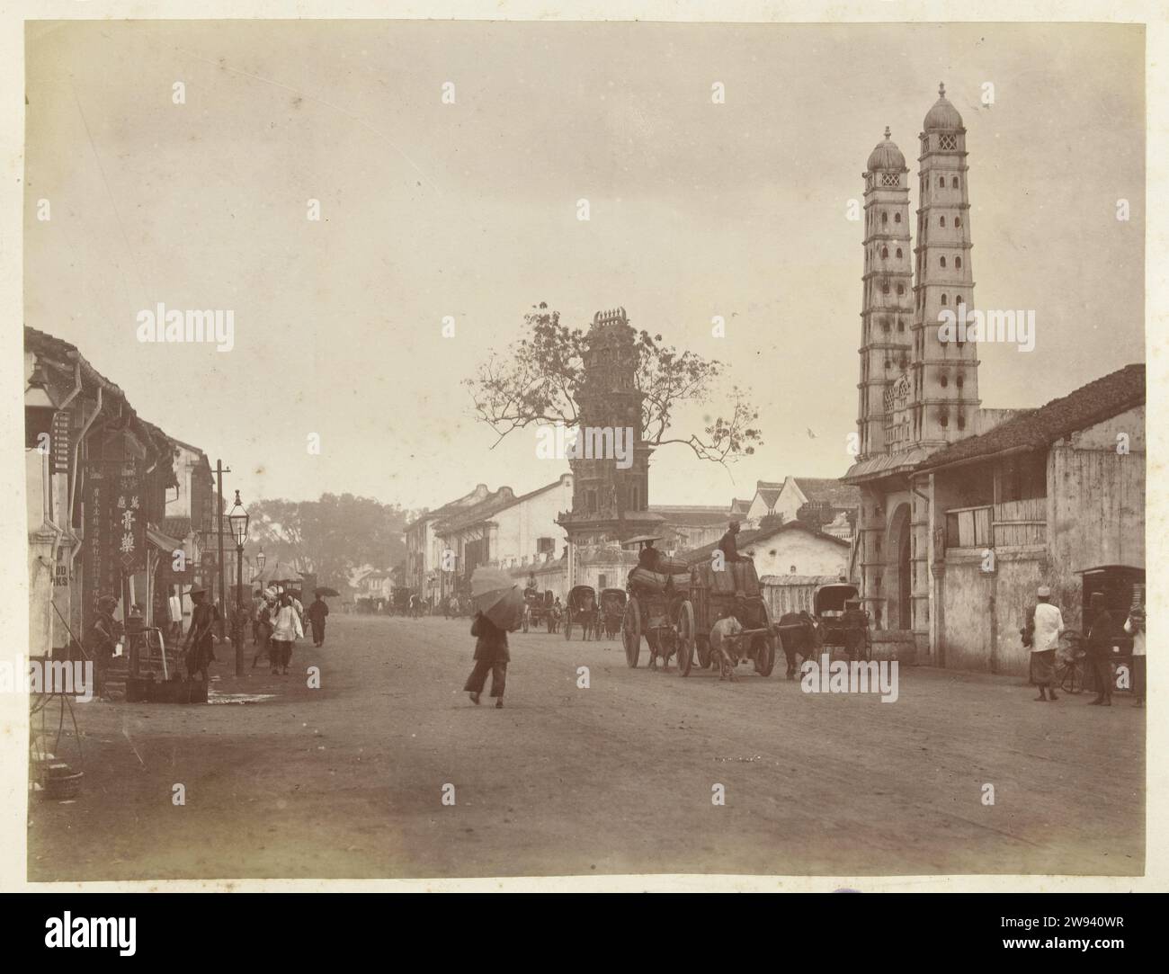 Local street face in Singapore with towers of temples and mosques, c ...