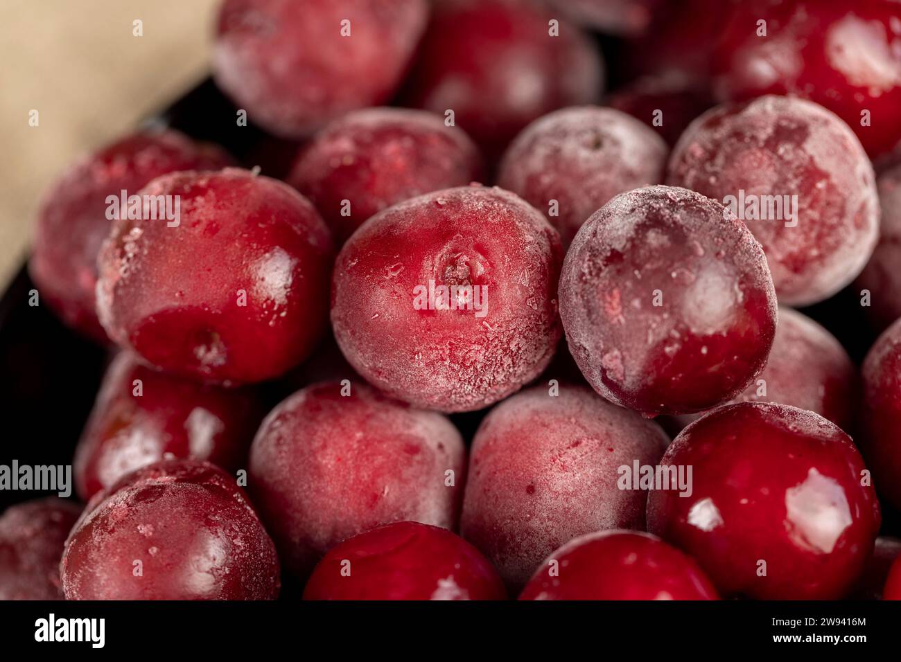 red cherry covered with a thin layer of ice, frozen for long-term ...