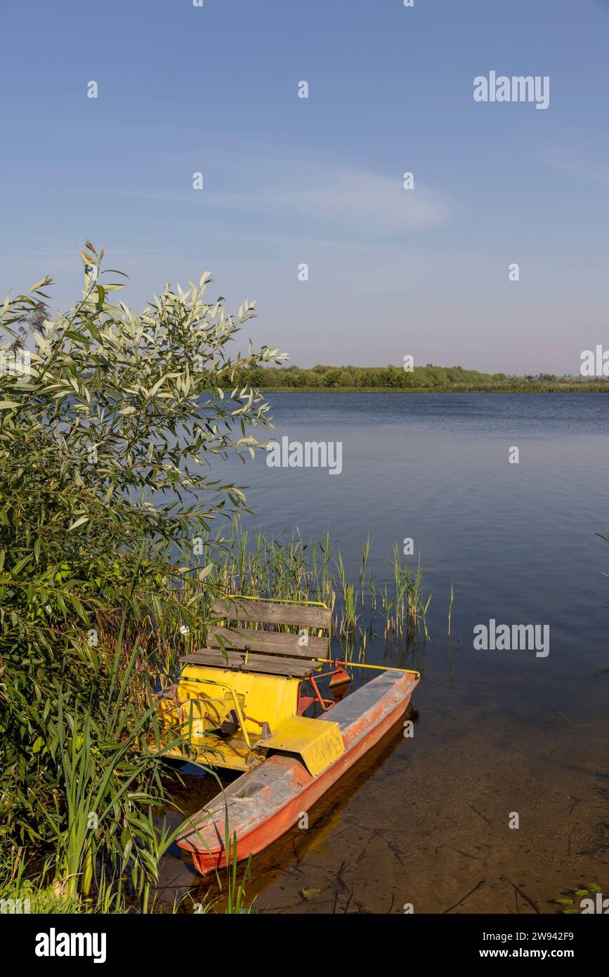 old catamaran on the lake shore, one old catamaran for walking on the ...