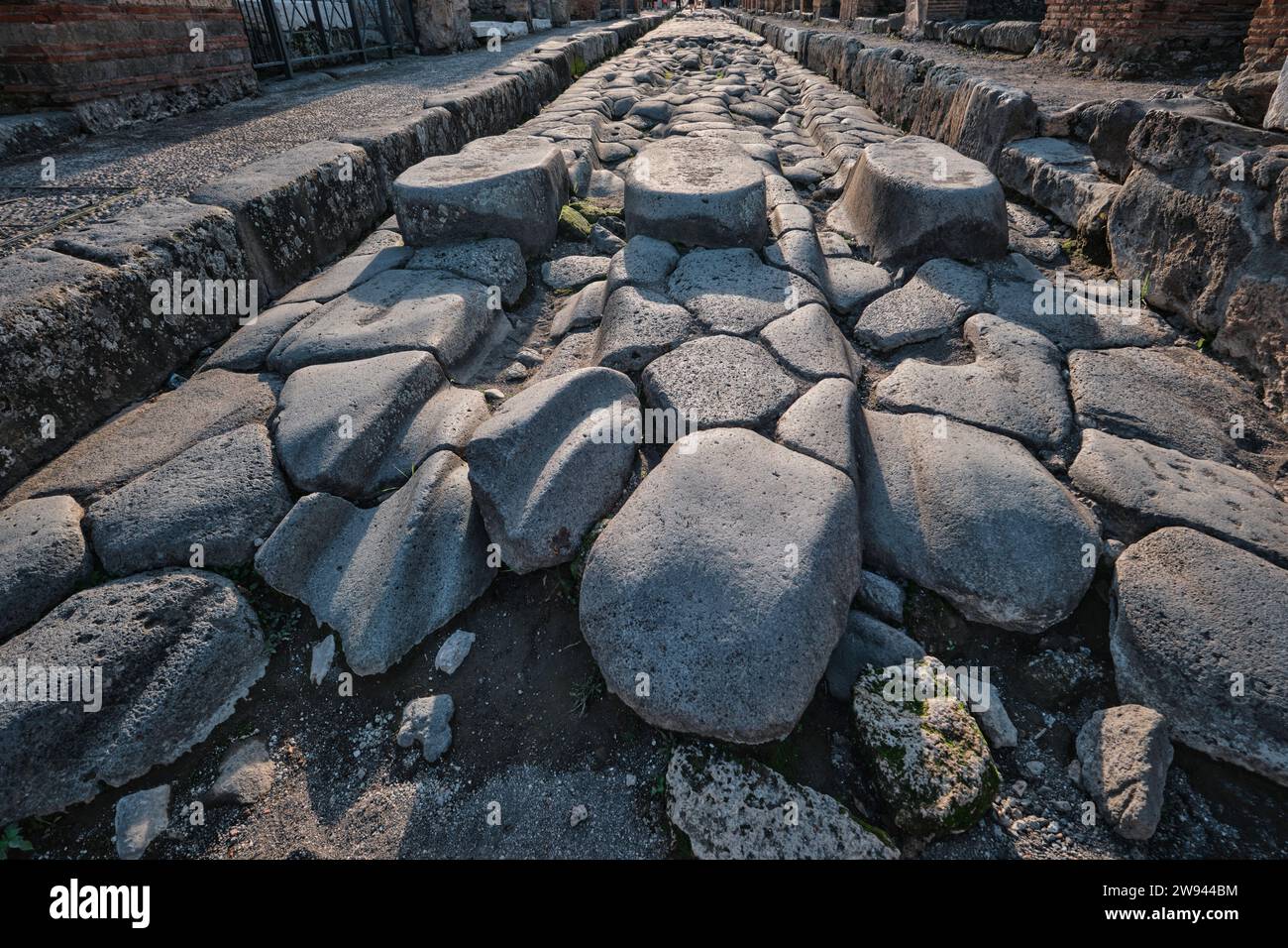 Naples, Italy - November 8 2023: Stepping stones for pedestrians of street in Ancient Roman city ...