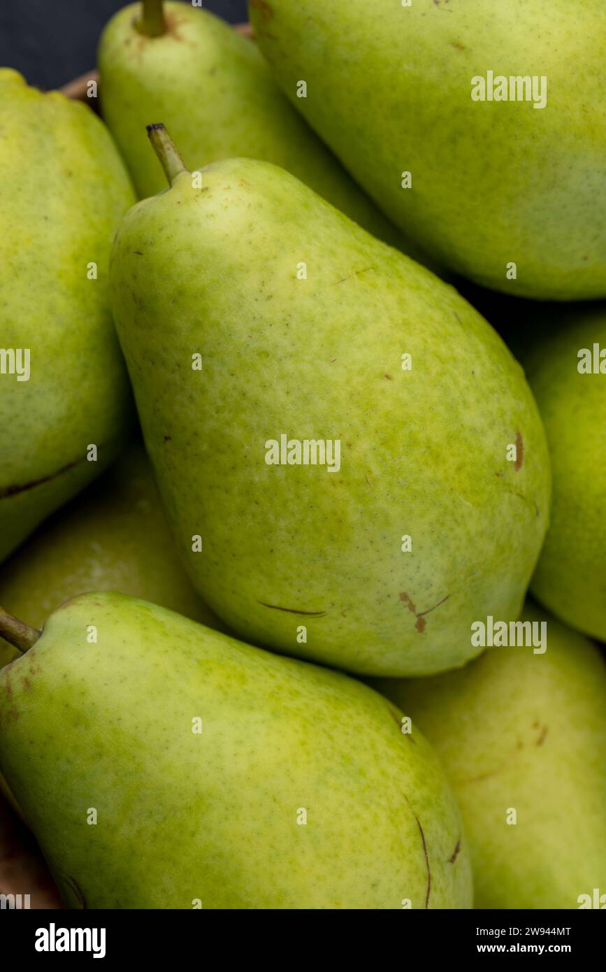 whole ripe and juicy green pears, delicious pears washed and ready for ...