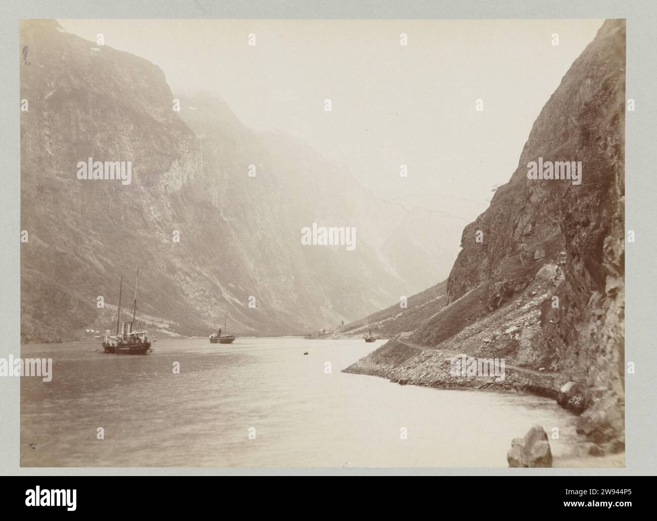 Ship on a river in the mountainous Norwegian landscape, 1889 photograph ...