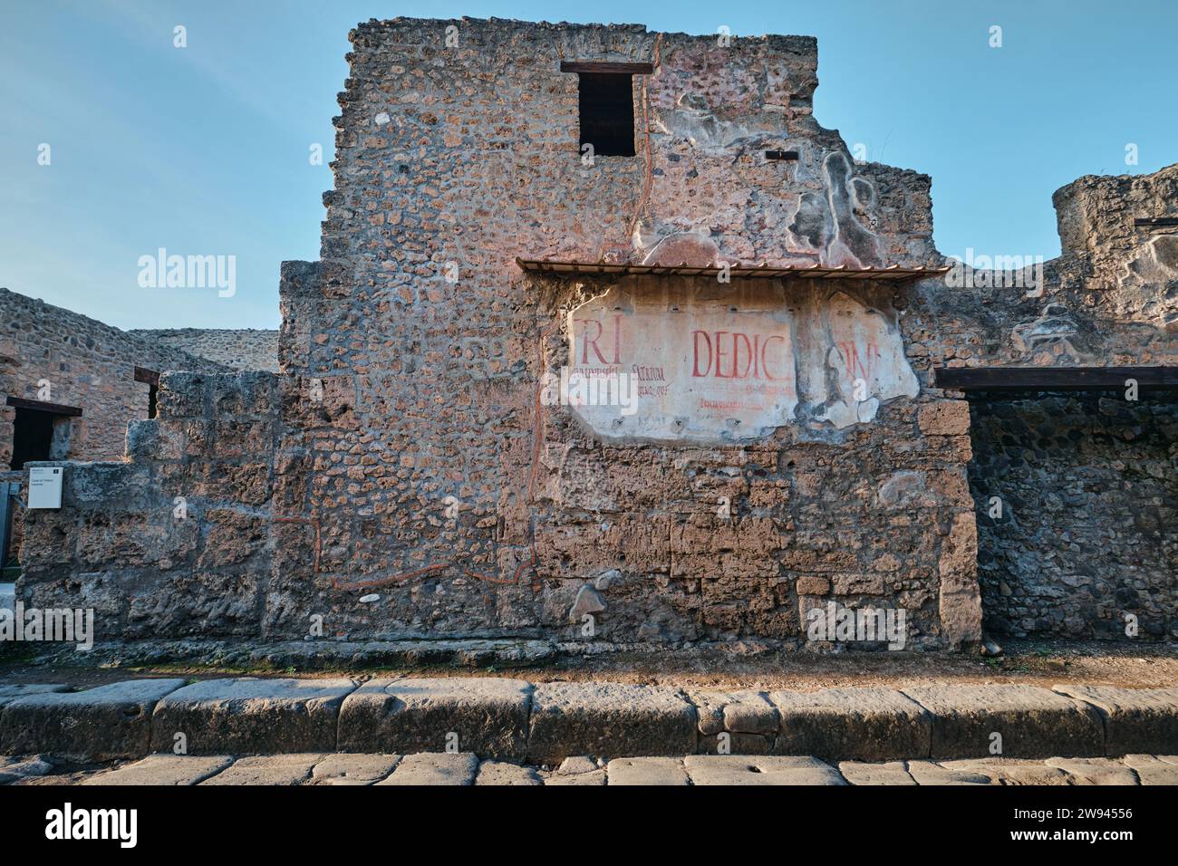 Naples, Italy - November 8 2023: : Ancient Latin graffiti on a wall of one of the ruins at ...