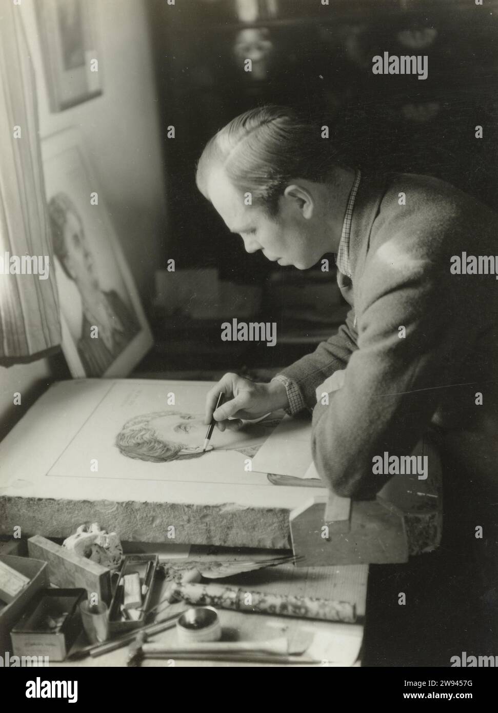 Artist Cor Visser is working on the portrait of Queen Wilhelmina., 1941 ...