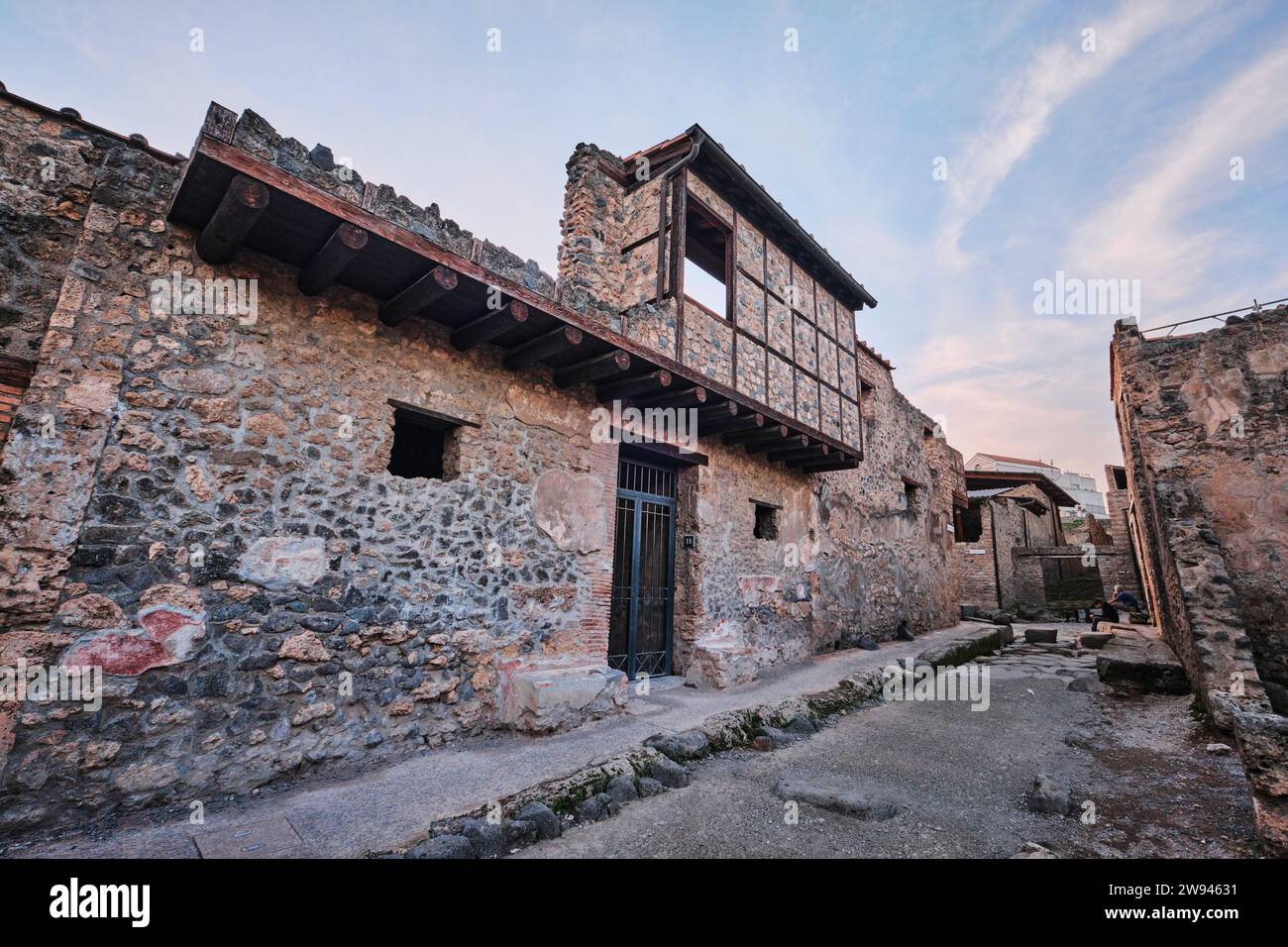 Naples, Italy - November 8 2023: Street view of an two storey building ruins in Pompeii ancient ...