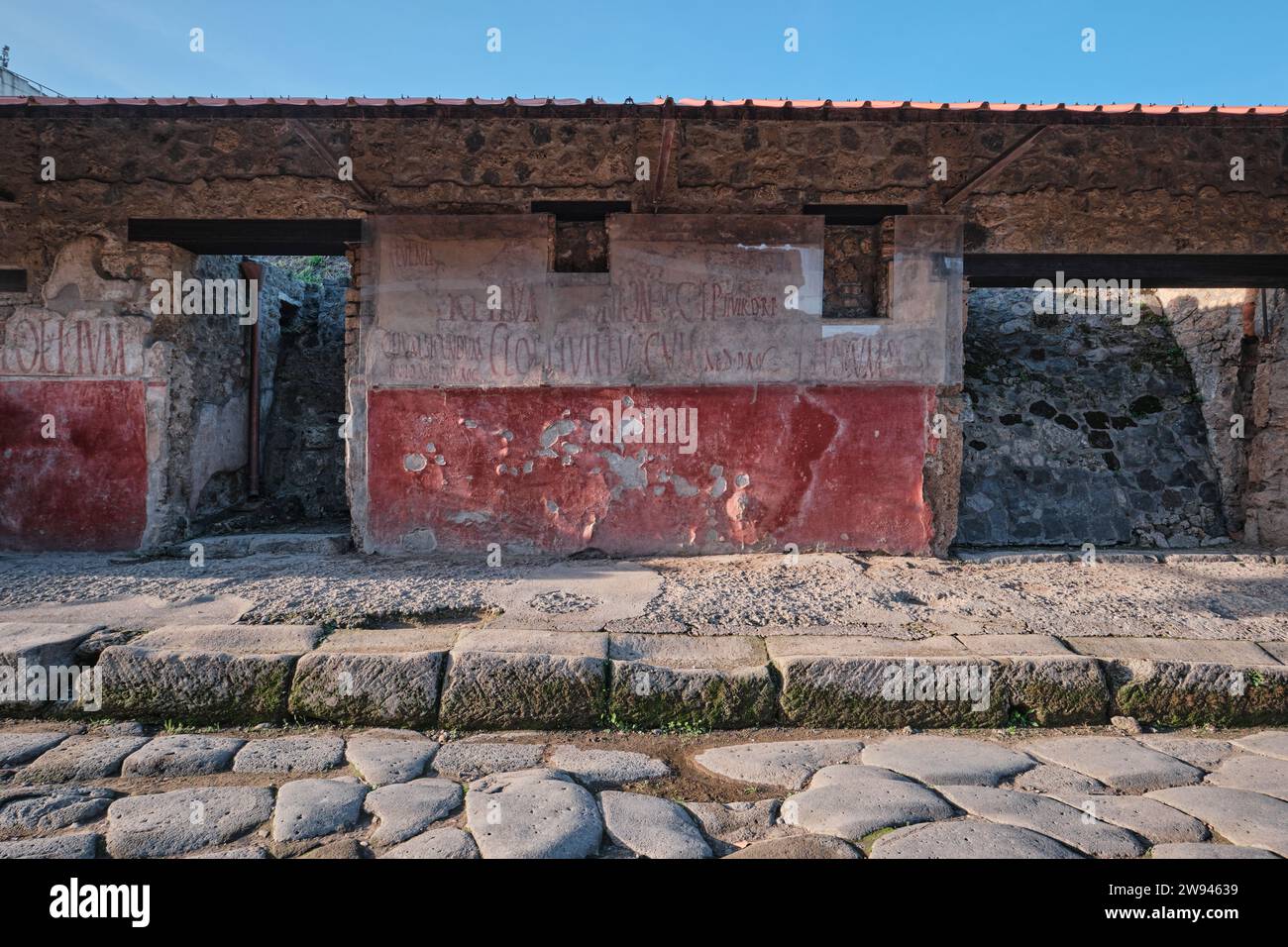 Naples, Italy - November 8 2023: : Ancient Latin graffiti on a wall of one of the ruins at ...