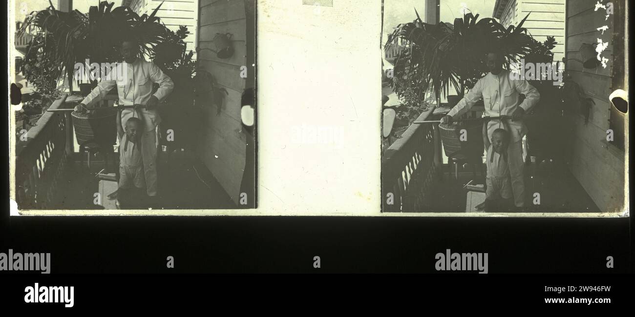 Father and son on Veranda in Paramaribo, 1913 - 1930 stereograph Man (Theodoor Brouwers) with ...