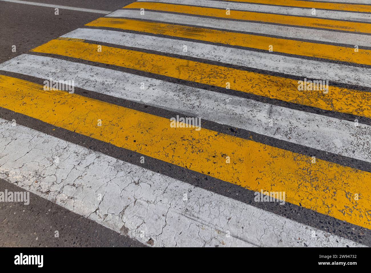 white and yellow pedestrian crossing on the road, pedestrian crossing ...