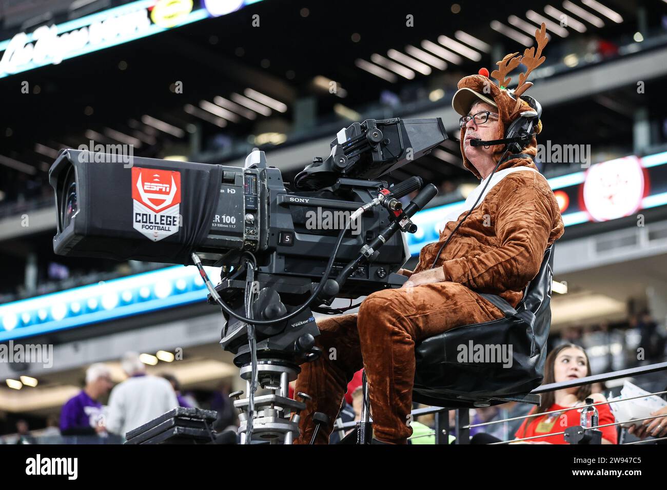 Las Vegas, NV, USA. 23rd Dec, 2023. An ESPN camera man, dressed as a ...
