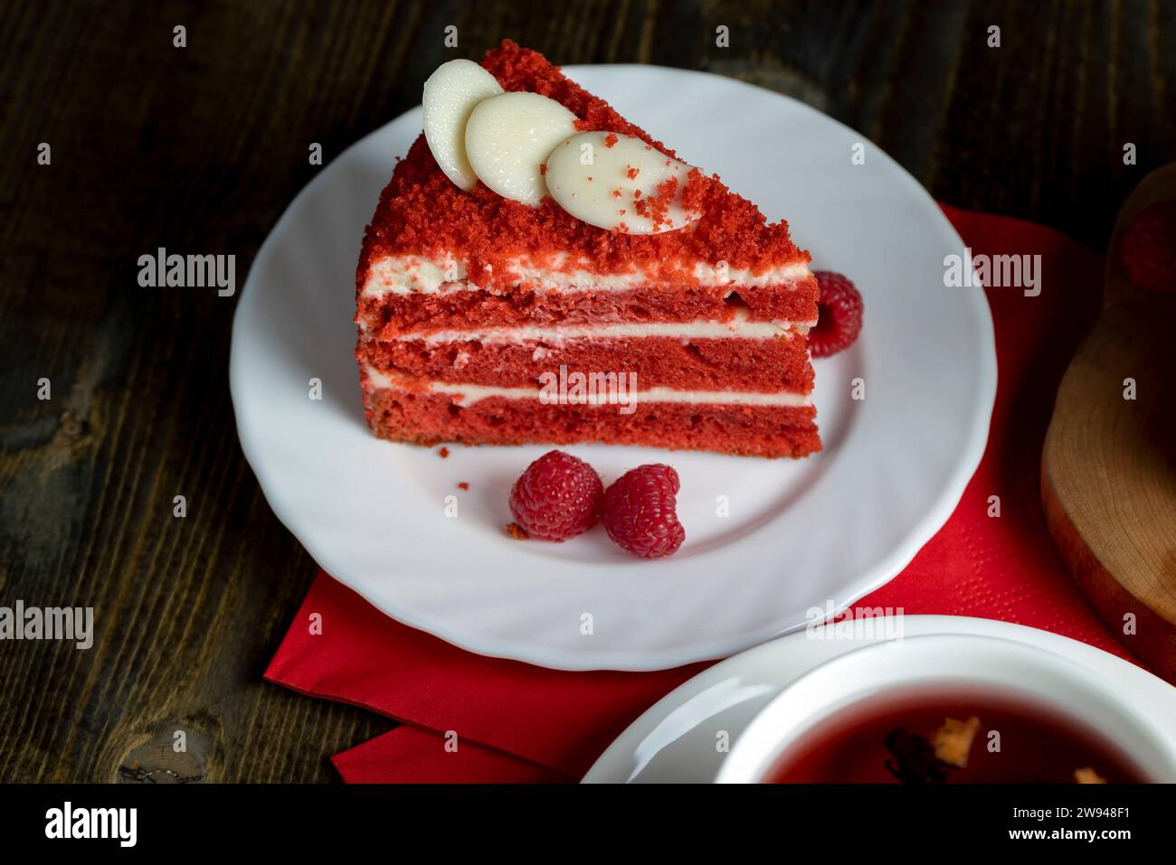 Red cake with cream and raspberry flavor, a piece of sweet dessert red ...