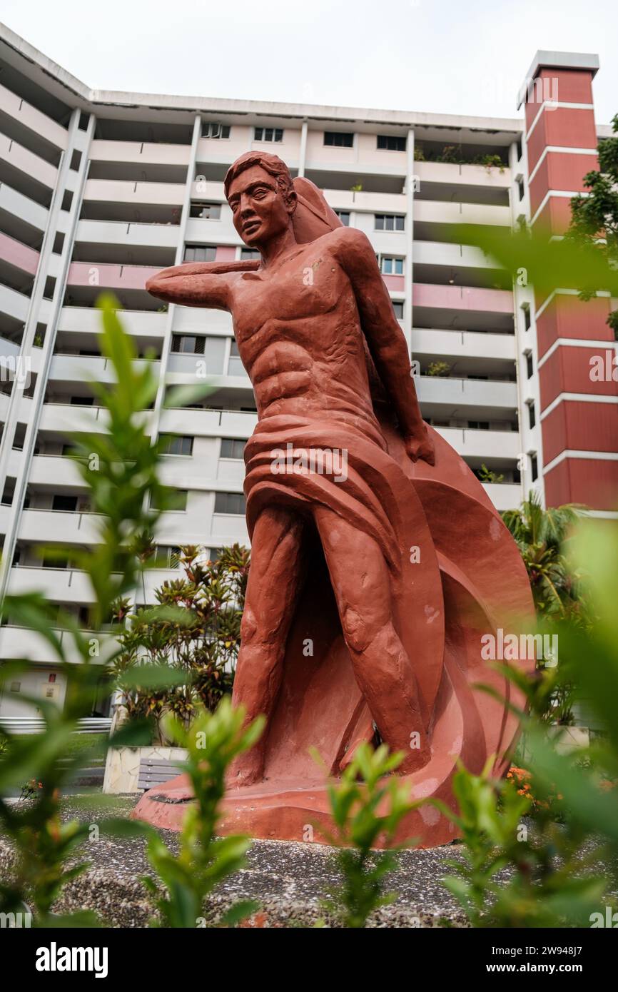 Red Human Statue with Fish in Urban Apartment Stock Photo - Alamy