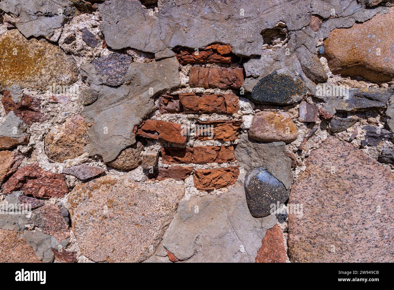 ancient wall of cobblestones and red bricks, combined ancient wall of ...