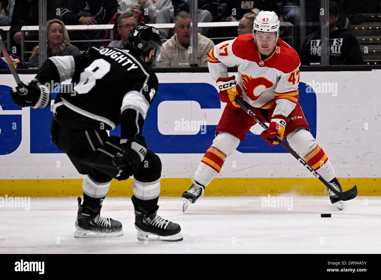 Calgary Flames center Connor Zary (47) controls the puck against Los ...