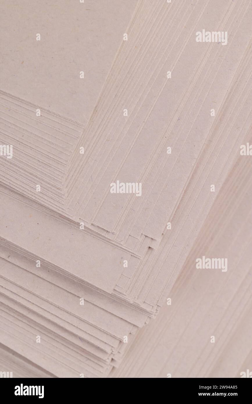 grey low-quality thin paper from recycled waste, paper used for writing ...