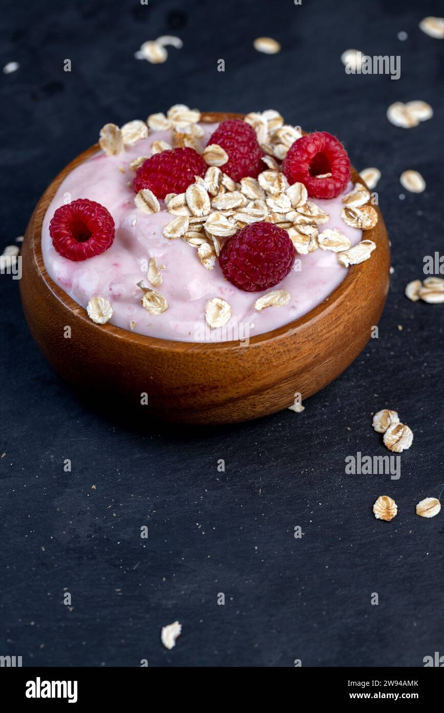fresh yogurt with raspberry flavor and oat flakes , milk yogurt with ...