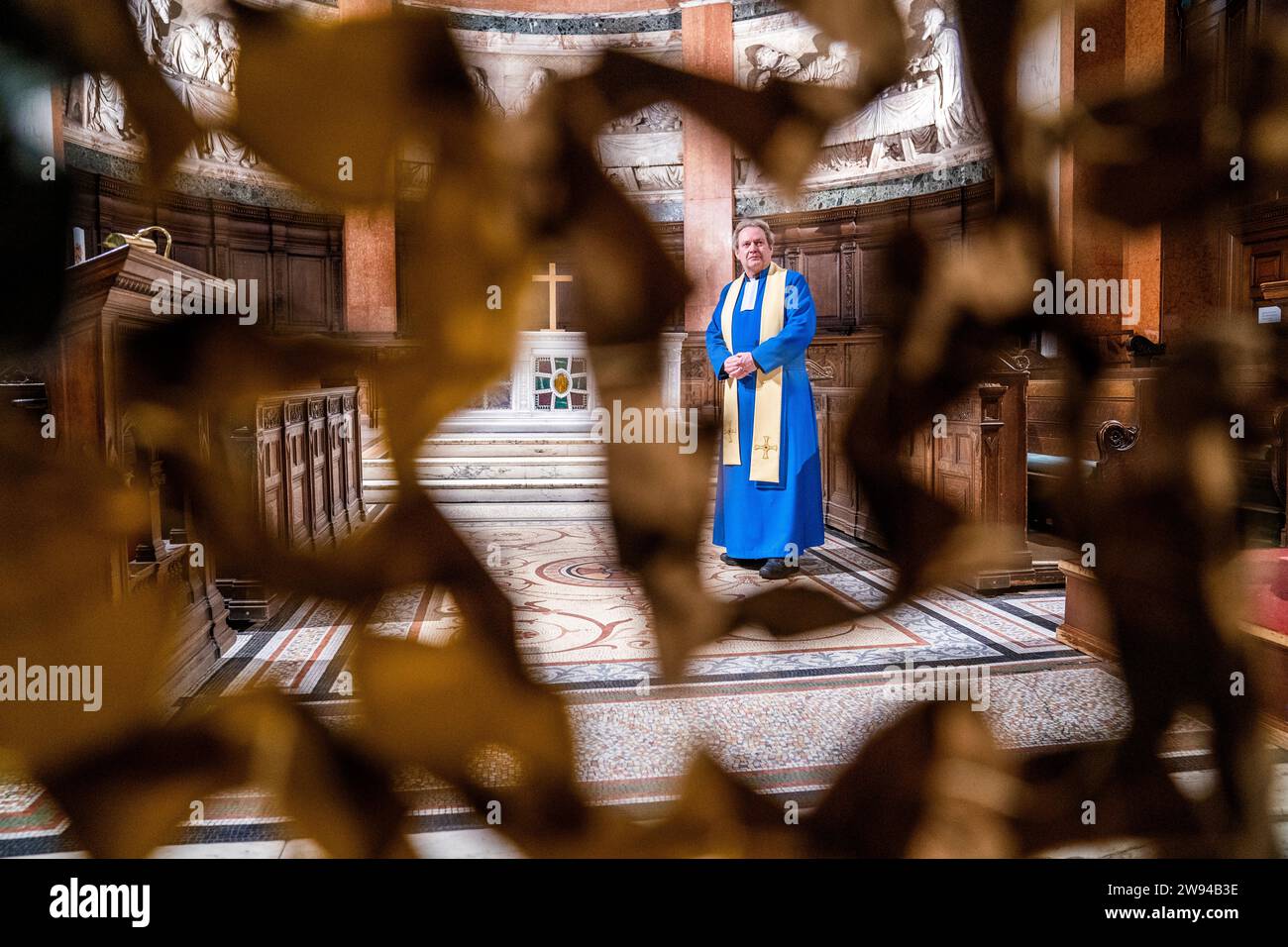 Parish minister Rev Peter Sutton stands alongside the nativity scene in ...